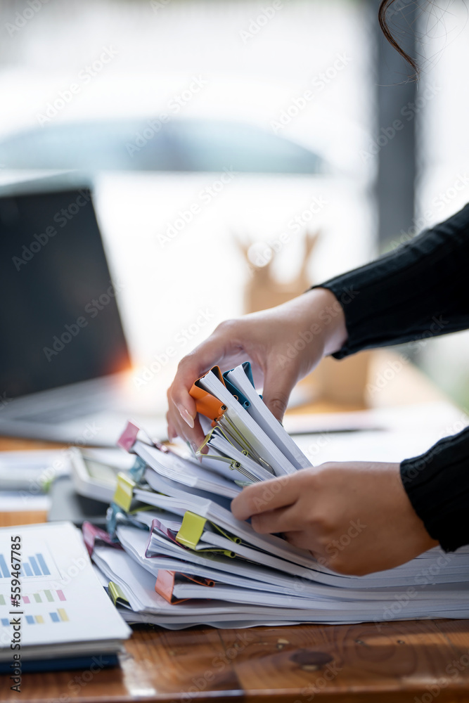Business Documents concept, woman hands working on Stacks paper files ...