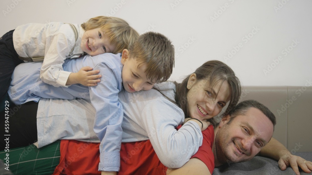 Happy family stack, kids and parents lying one on top of another Photos ...