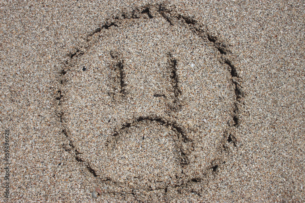 sad emoticon on beach sand Stock Photo | Adobe Stock