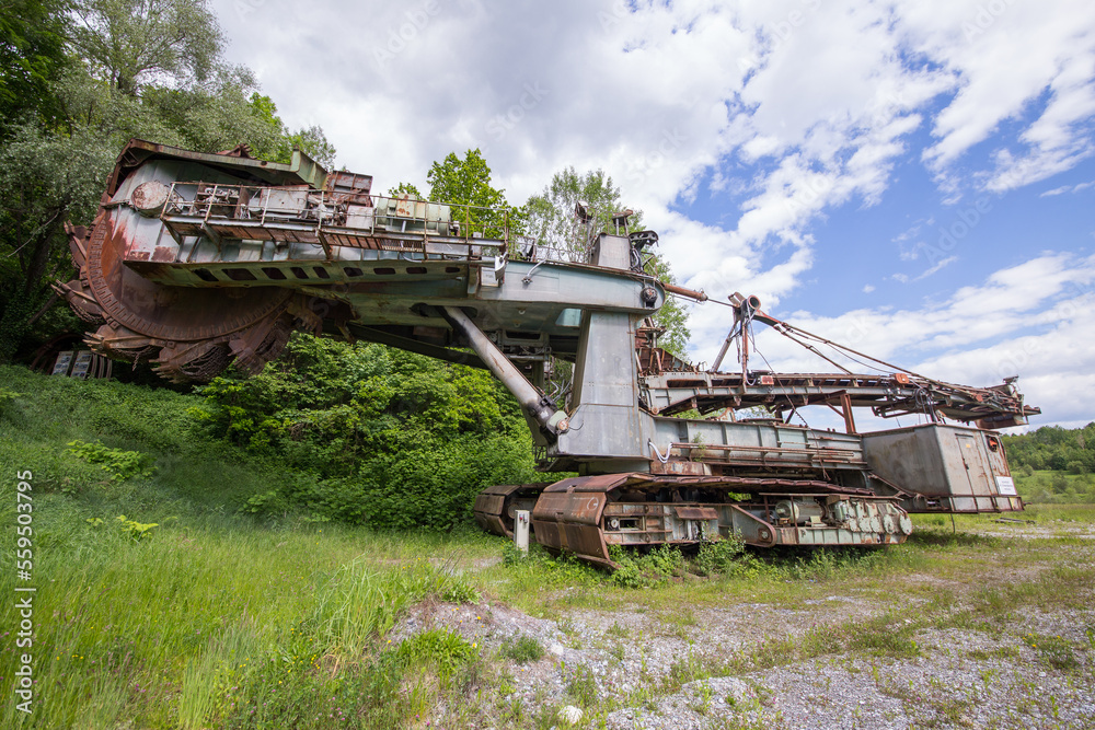 Abandoned huge coal mining digging machine parked somewhere on an old ...