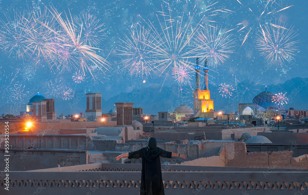 Happy Iranian girl's arms up with wearing abaya Fireworks in the ...