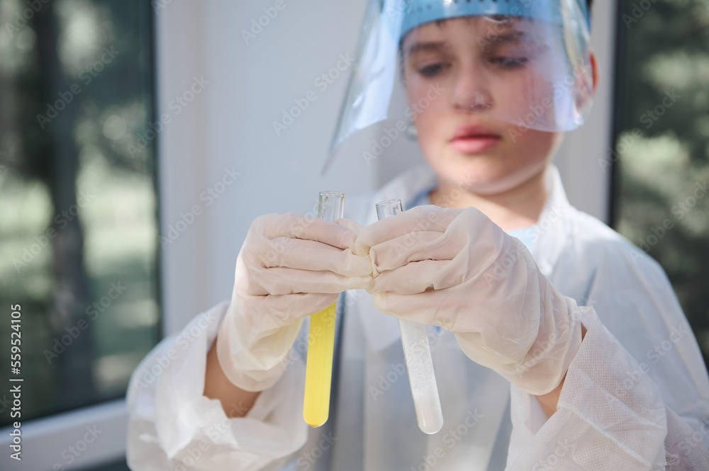 Details: gloved hands of a blurred smart teen schoolboy, wearing ...