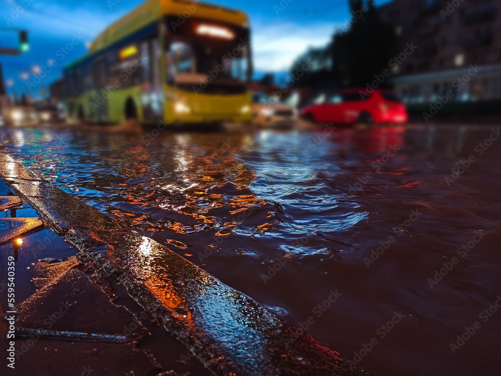 Flooded city road with large puddle. Flooding after heavy rains at city ...