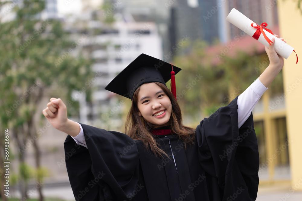 Successful graduation from university. Smiling beautiful Asian girl ...