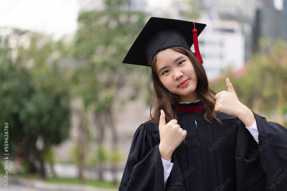 Successful graduation from university. Smiling beautiful Asian girl ...