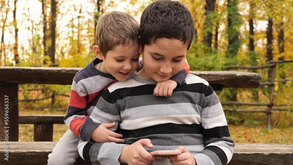 Children playing games and checking social media at school. Generation ...