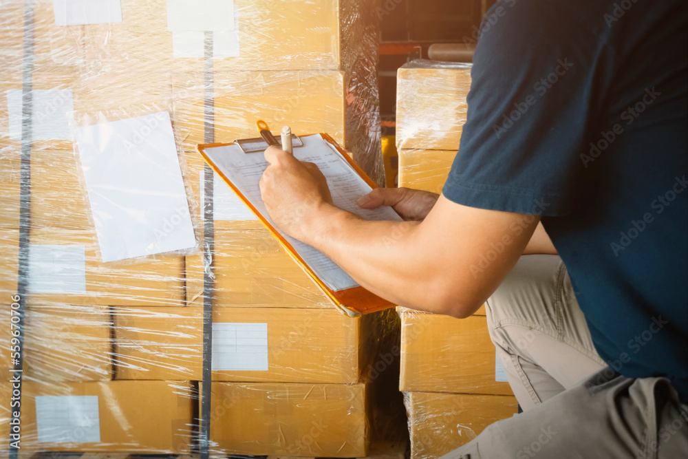 Workers Holding Clipboard is Checking Stock of Packaging Boxes. Cartons ...