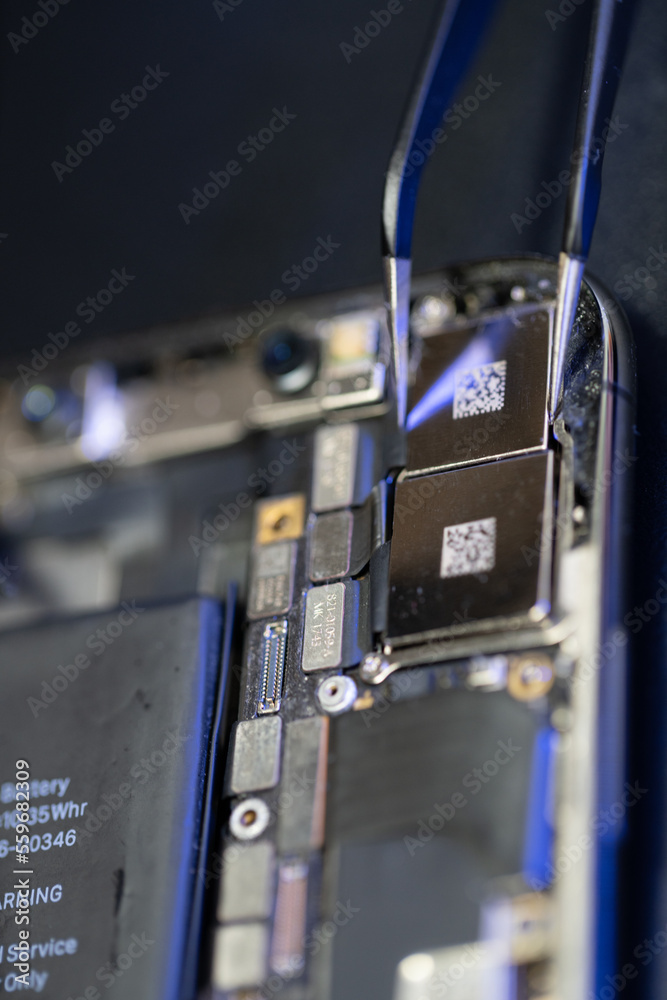 Repairing Smartphone, iPhone internals with tweezers. Stock Photo ...