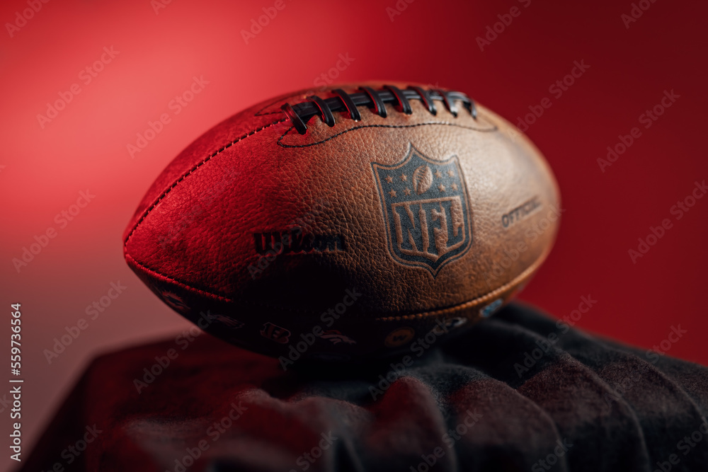 A football in epic light situation with the logo of the official brand ...