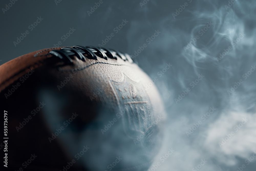 A football in epic light situation with the logo of the official brand ...