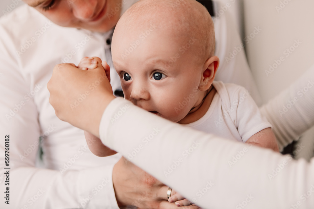 Little boy pop-eyed surprised cute child baby playing with parents ...