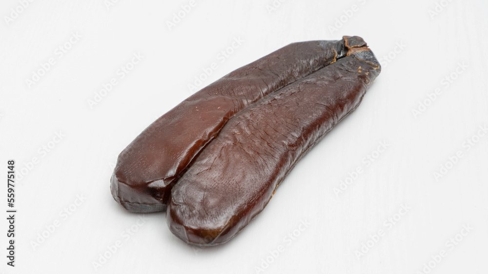 Bottarga, cured fish roe of grey mullet on white background Stock Photo ...