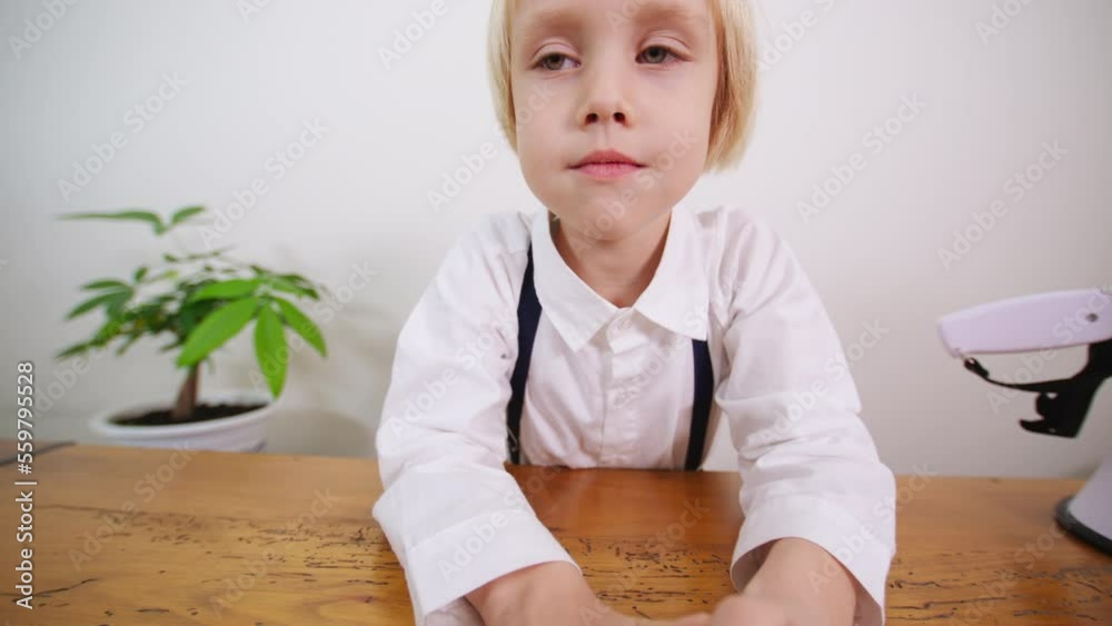 Close portrait of 5 years old caucasian boy making funny faces into the ...