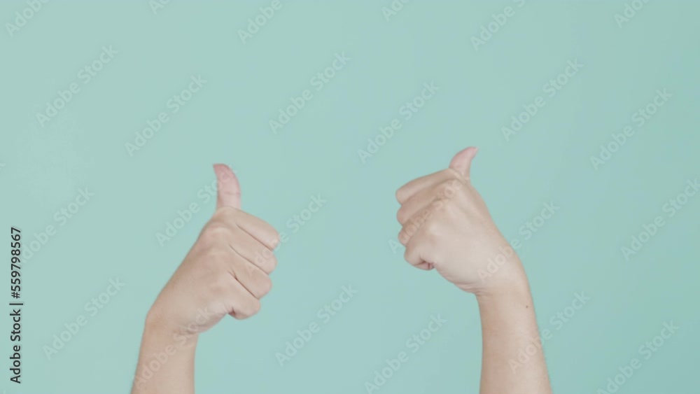 Close up of male's hand thumbs up making good sign doing the hand ...