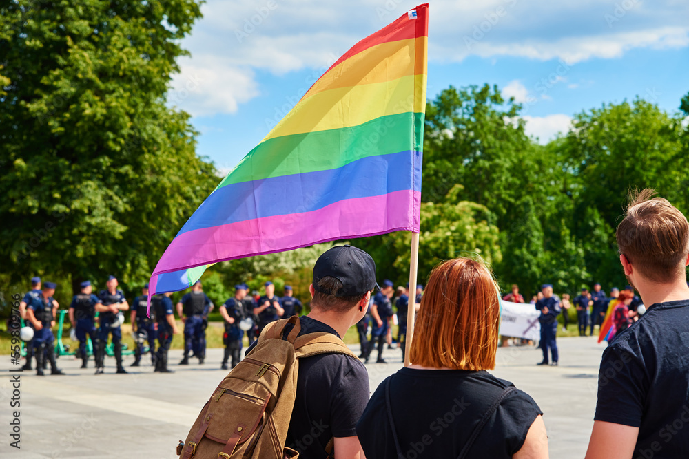 People crowd with LGBTQ rainbow flags on pride parade. Tolerance ...