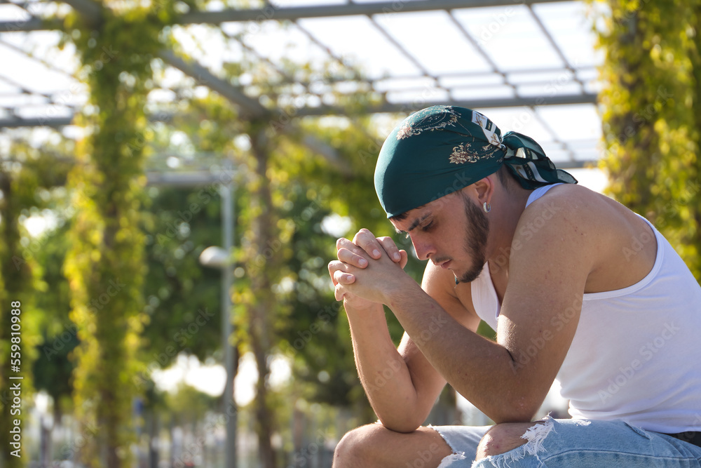 Latin and Hispanic boy, young, rebellious, with headscarf and hands ...