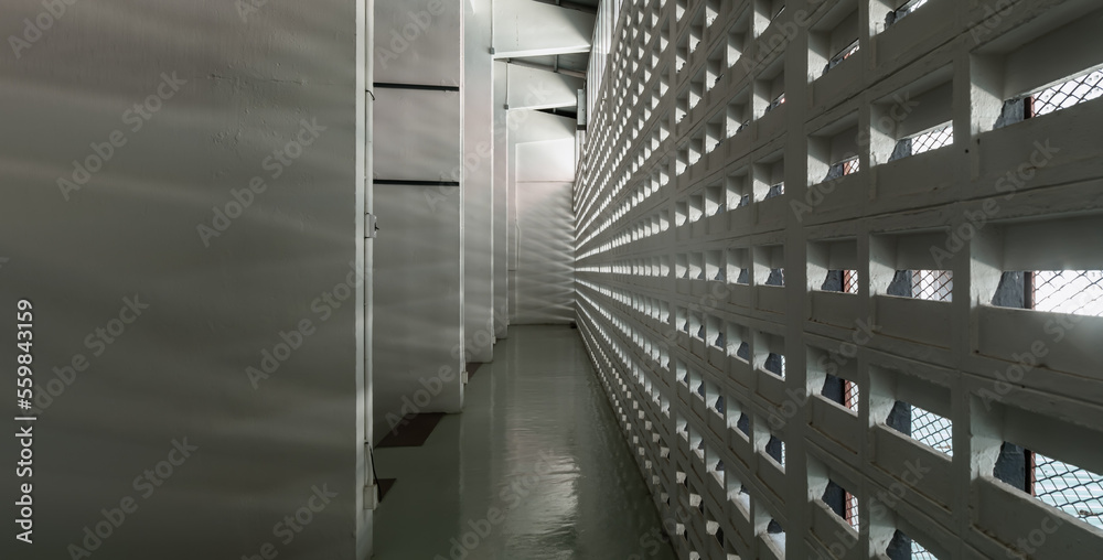 The sunlight shines through light channels wall of old gymnasium ...