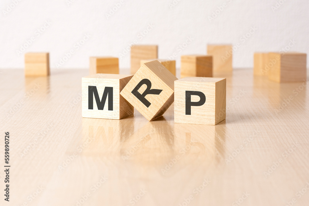 MRP - an abbreviation of wooden blocks with letters on a gray ...