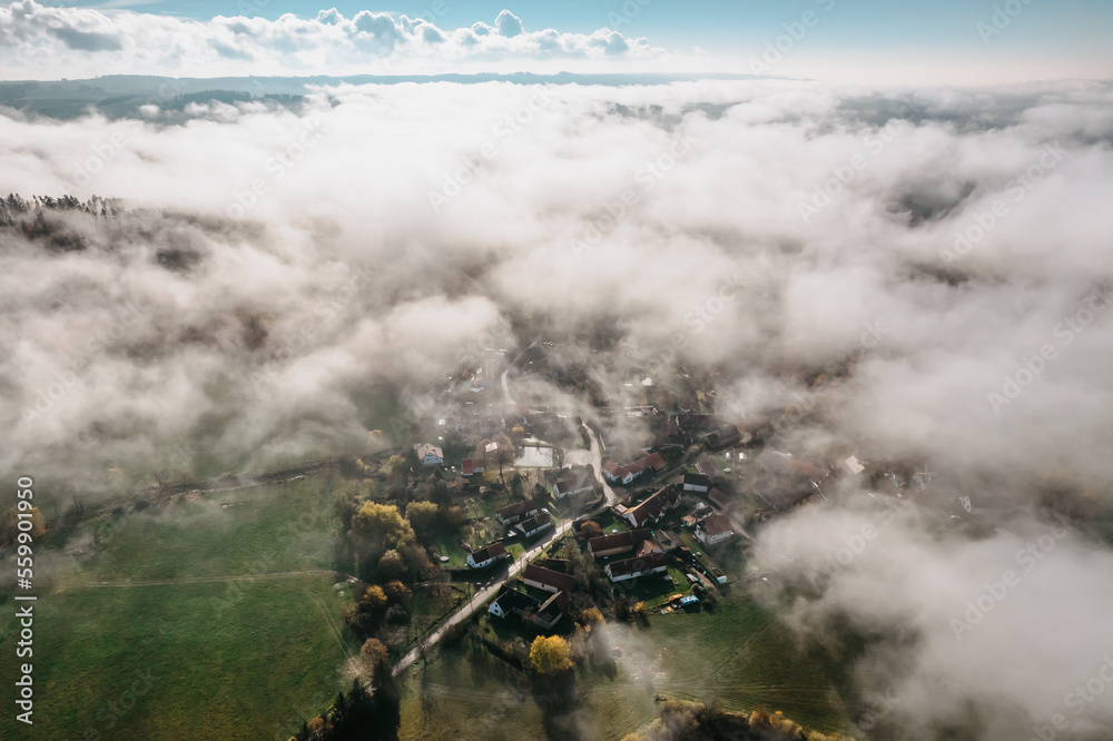 Aerial view of small village in fog.Top view of traditional housing ...