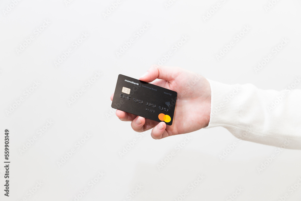 Kyiv, Ukraine - December, 2 2022: Close up of female hand holding black ...