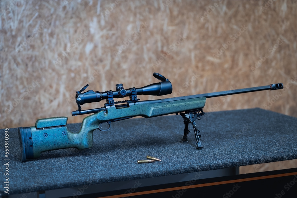 Sniper rifle with an optical sight in a shooting range. Stock Photo ...