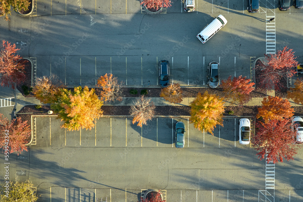 View from above of many parked cars on parking lot with lines and ...