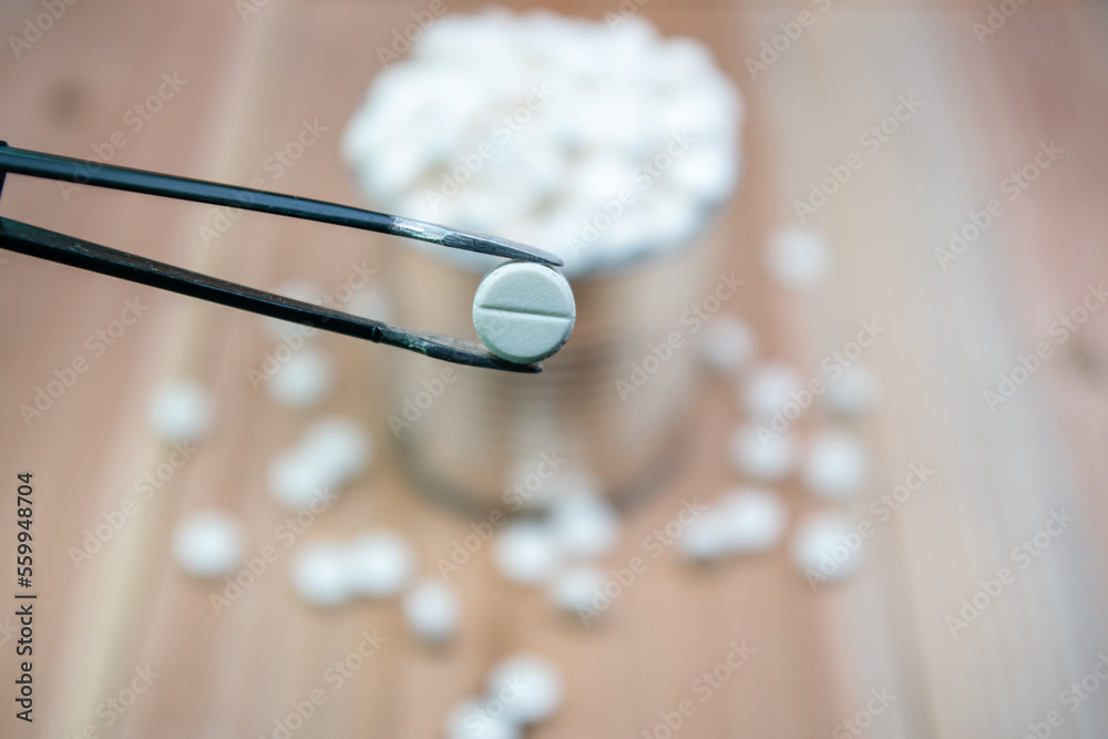 pill, held by forceps. The cures are often prescribed and conveyed ...