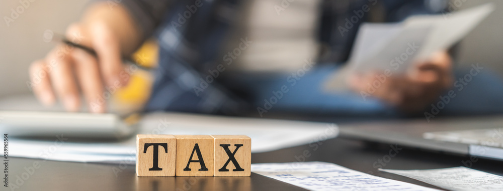 Deduction planning concept, blur background hand using calculator to ...