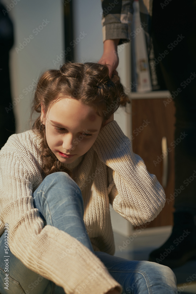 The concept of domestic abuse of a child by mother. The mother's hand ...