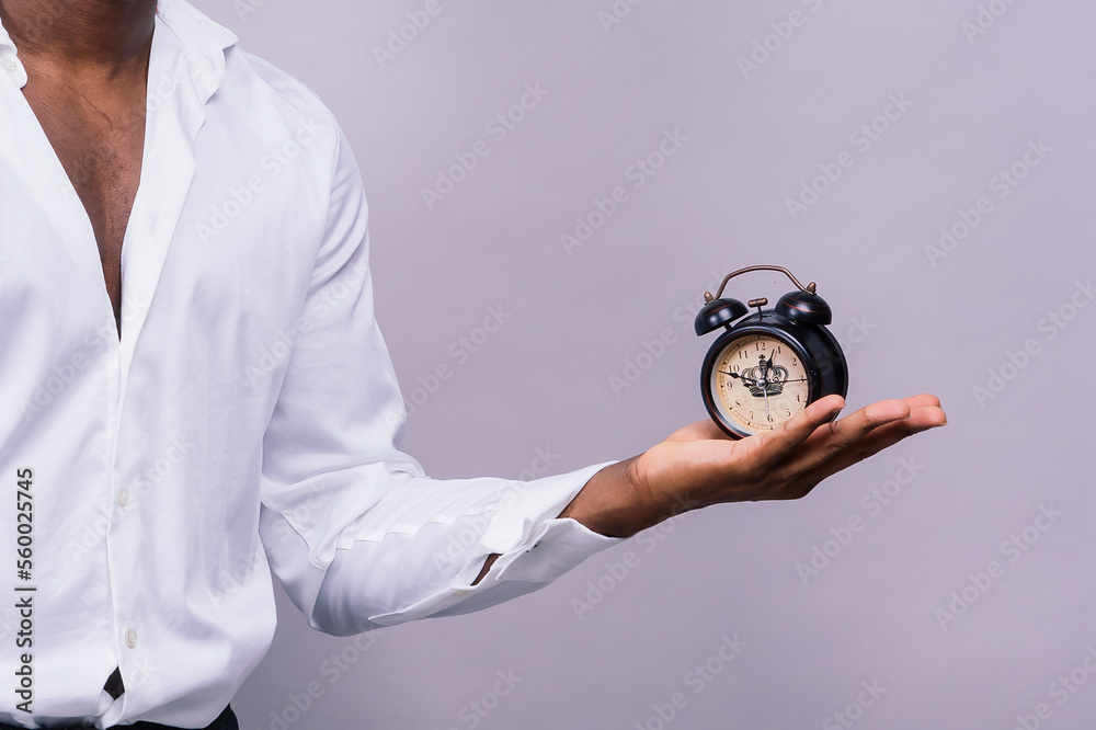 Time Management Concept. Shocked black man holding wall clock, running ...