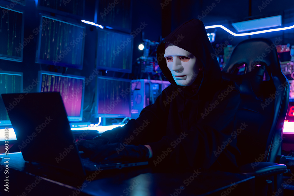 Female Asian hacker in hideout place with dark environment and multiple ...