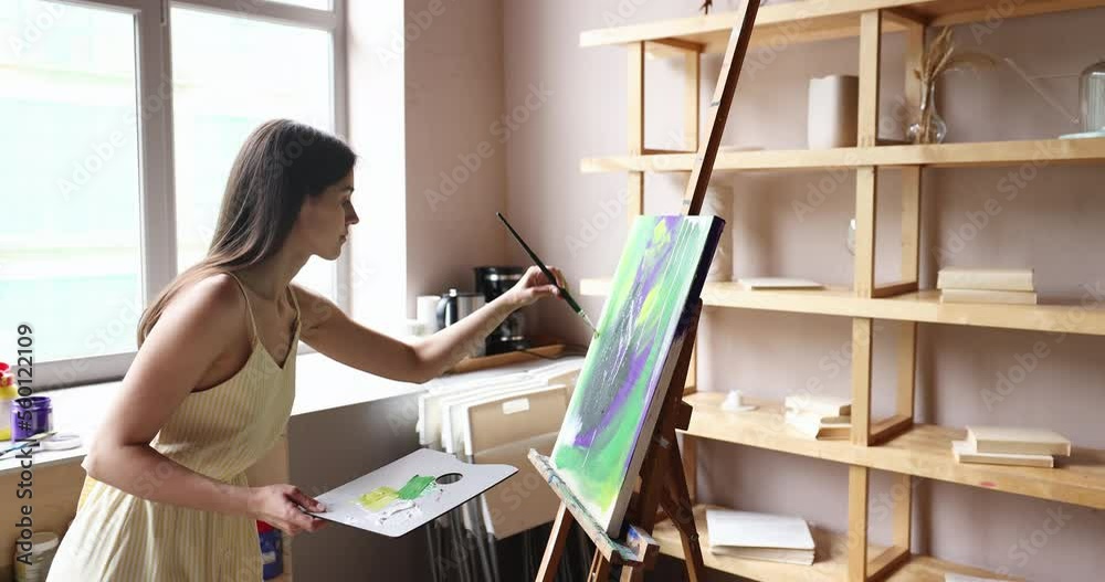 Side view attractive young painter woman, talented female artist ...