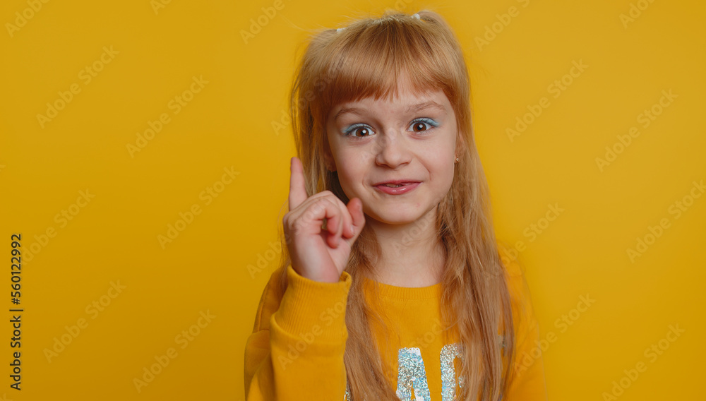 Young preteen child girl kid shakes finger and saying no, be careful ...