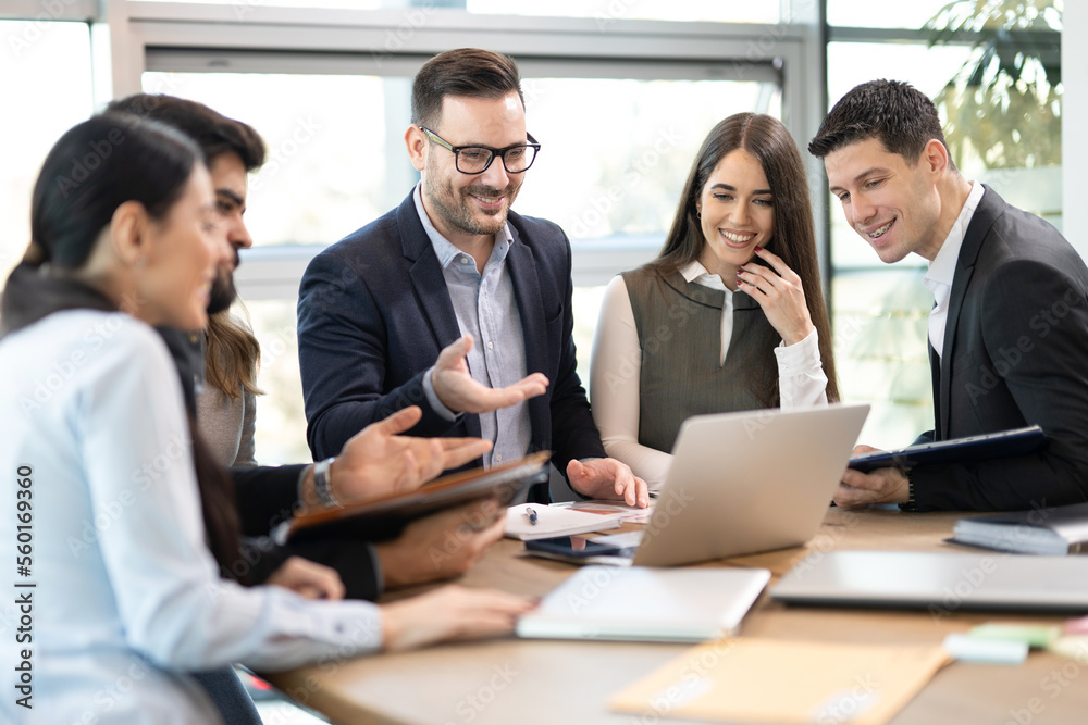 Group of creative business team using together laptop in office, having ...