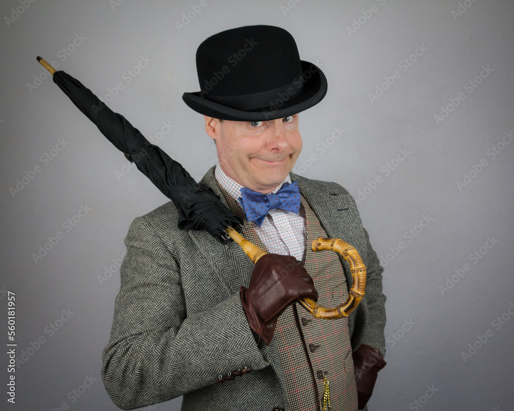 British Character in Tweed Suit and Bowler Hat Holding Umbrella Over ...