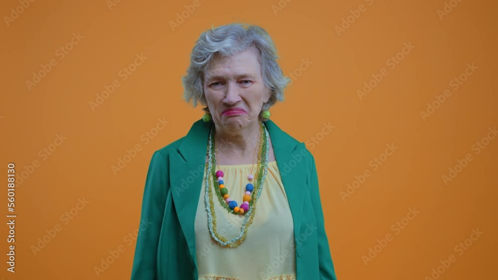 Funny grandmother old woman posing on colored background. Grandma ...