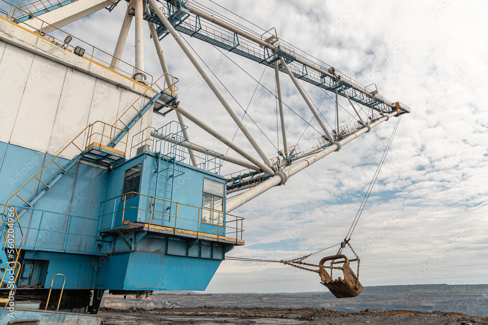 Walking excavator working at coal mine. Dragline Excavator Loads Soil ...