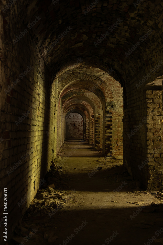 A long dark dimly tunnel of an abandoned military bunker or bomb ...