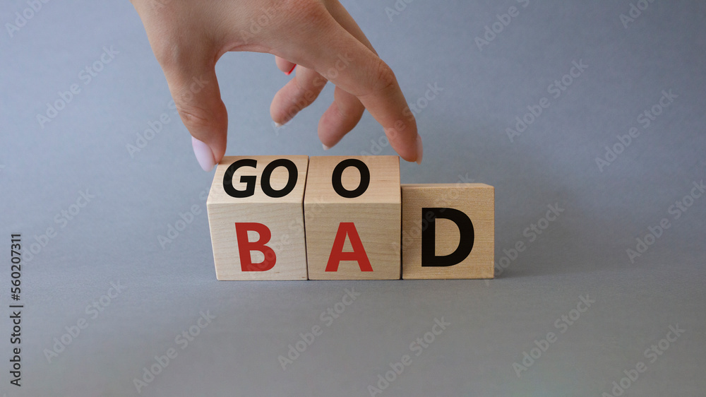 Good vs Bad symbol. Businessman Hand turns cubes and changes word Bad ...