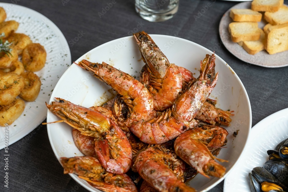 Red prawns cooked with garlic and parsley. Typical Mediterranean and ...
