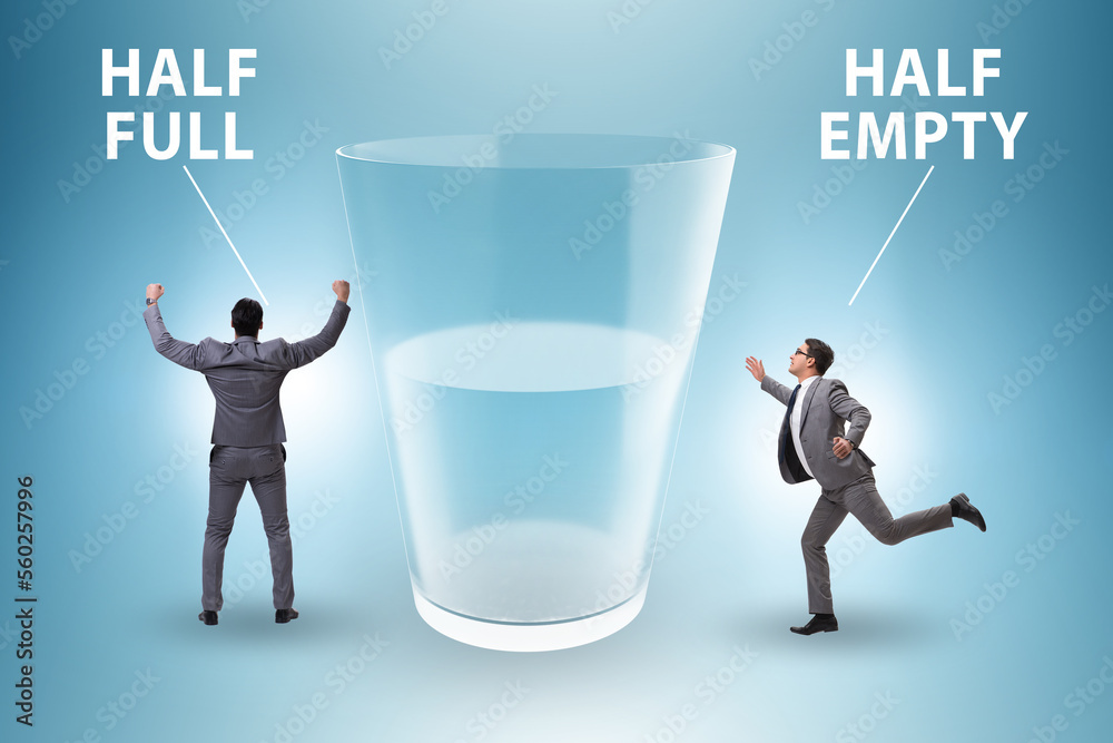Businessman in half empty half full glass concept Stock Photo | Adobe Stock