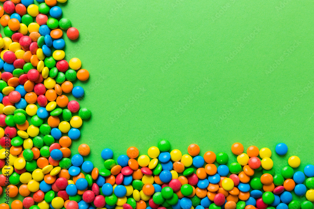 Mixed collection of colorful candy, on colored background. Flat lay ...