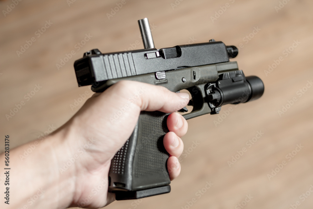 Bullet pistol gun malfunctions. Close-up detail view of pistol, handgun ...