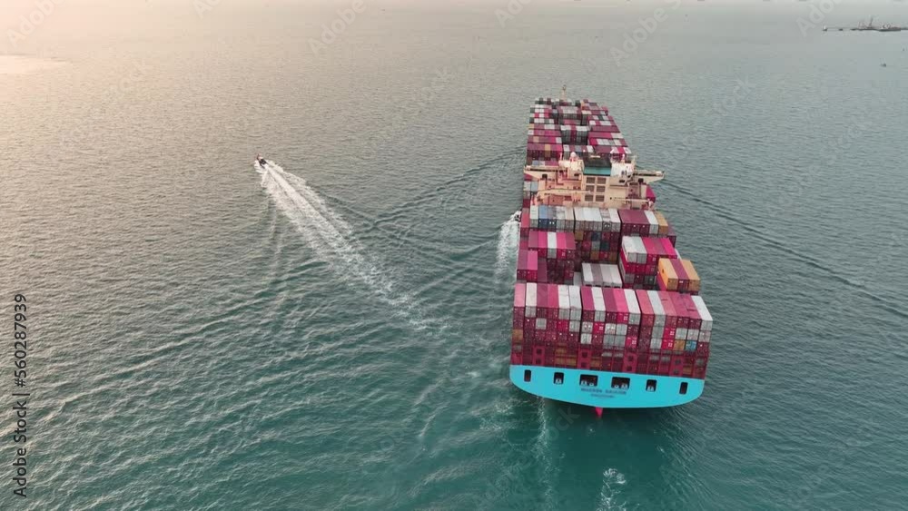 Stern Cargo ship carrying container and running very fast for export ...