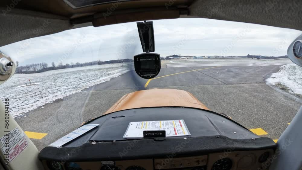 POV inside light airplane cockpit taking off from landing strip ...