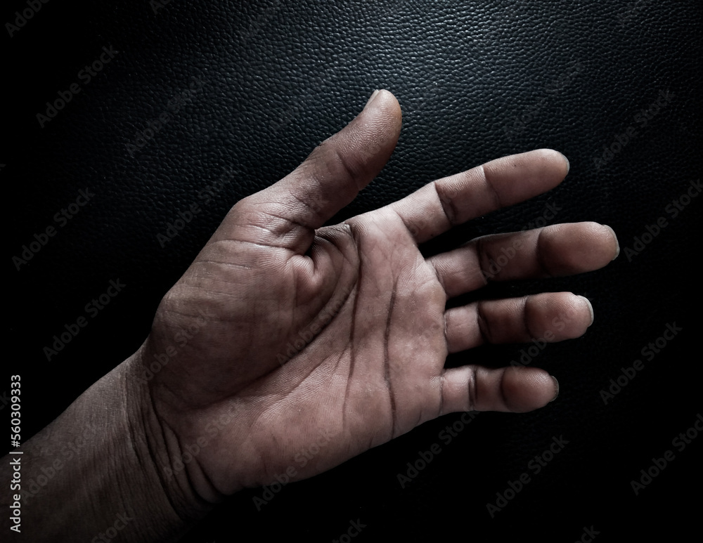 Dead hand on a black background background design template violence war ...
