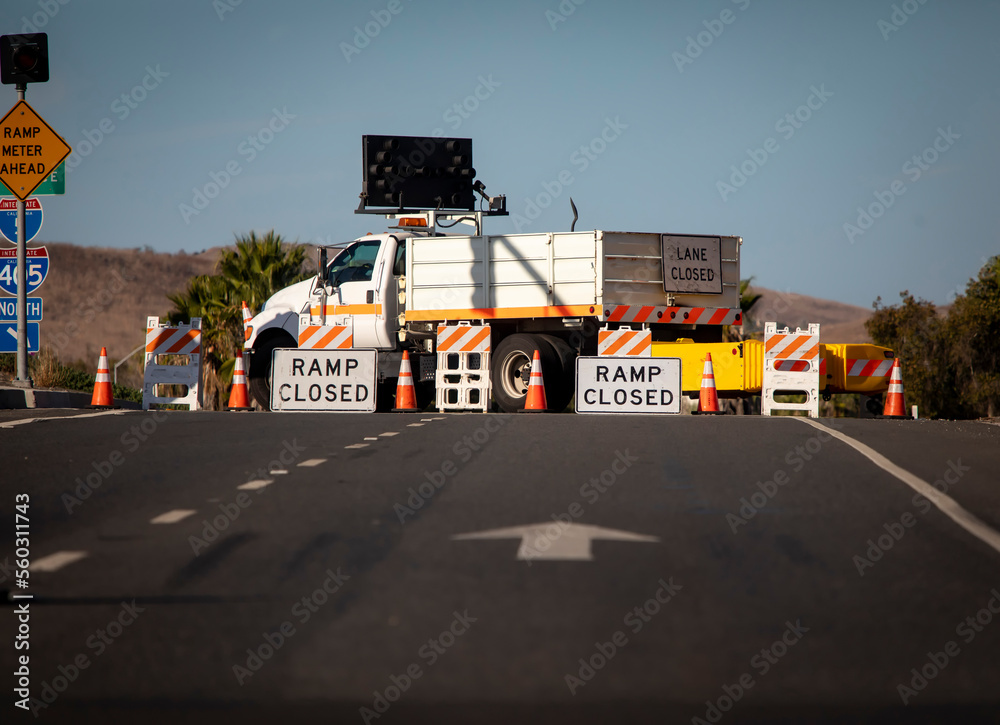 Traffic caused by a sign and cones indicating a freeway onramp is ...