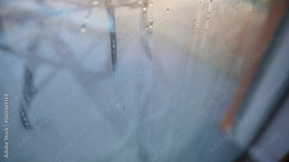 Water droplets on an indoor window during cold winter causing ...