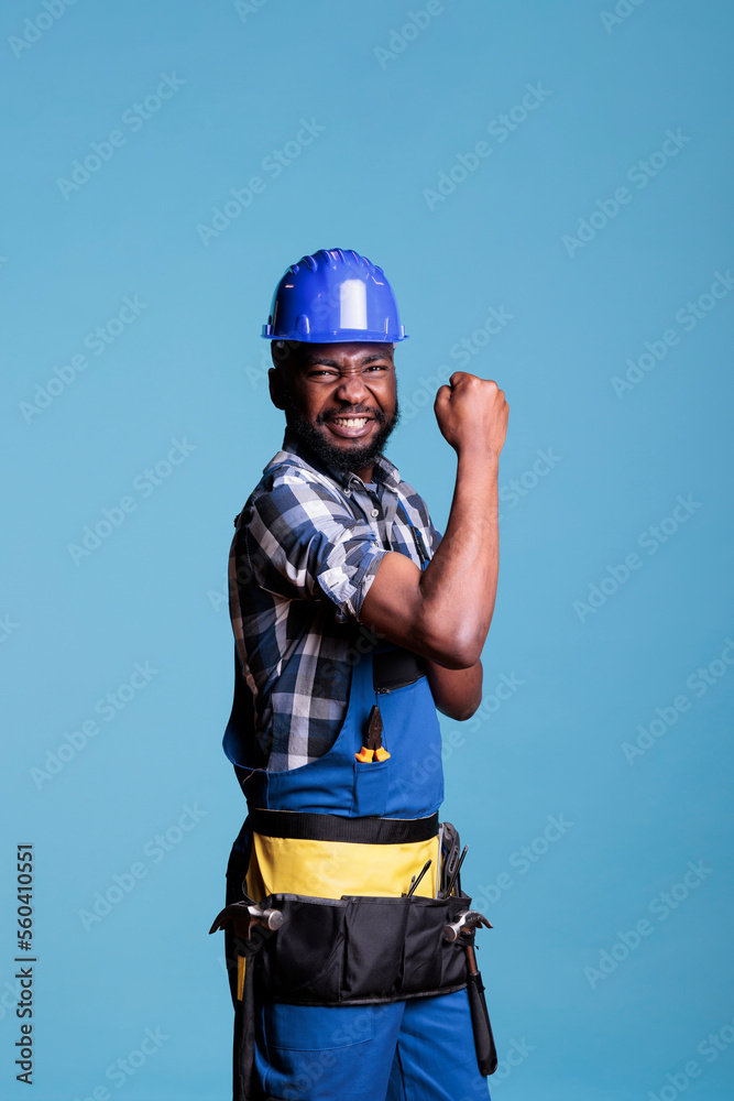 Strong builder flexing biceps and triceps muscles on camera, showing ...