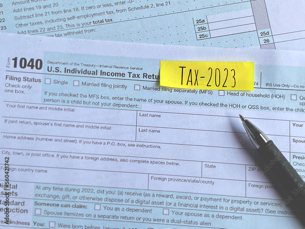 Tax-filling concept - TAX 2023 text background. Close up with top view ...